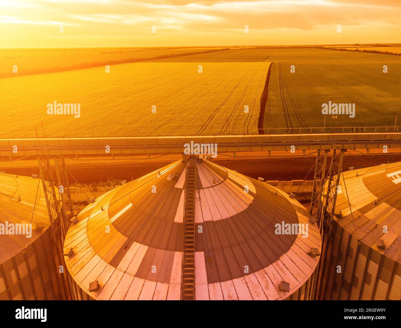 Modern metal silos on agro-processing and manufacturing plant. Aerial ...