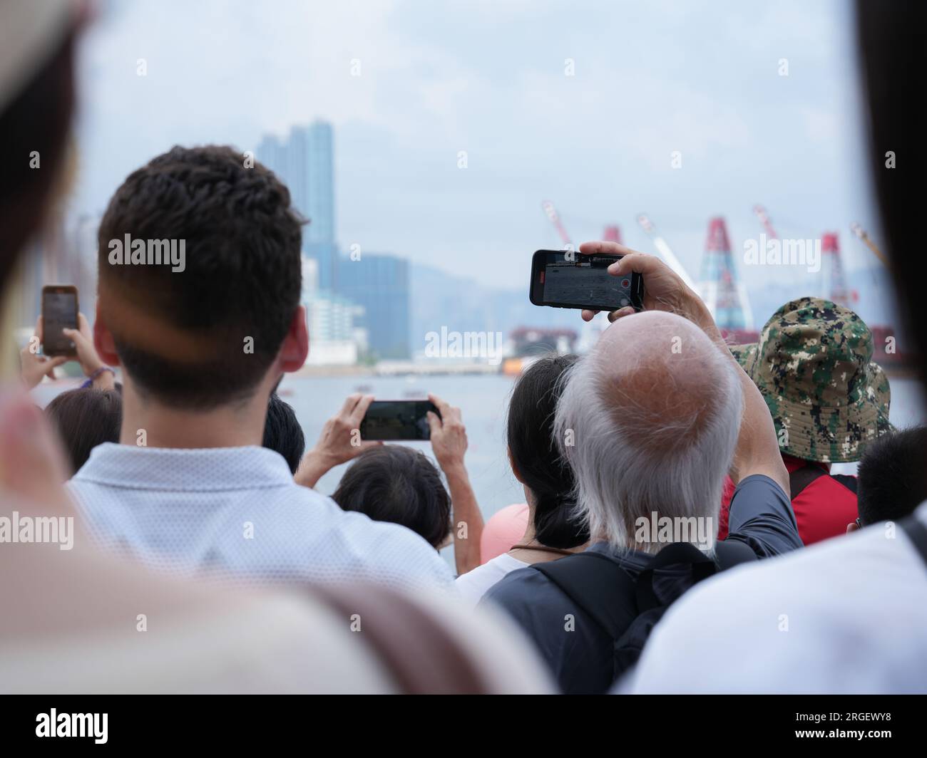 People focus on their own shooting for competition held on dragon boat ...
