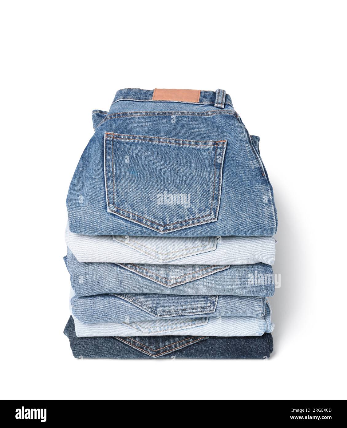 Stack of different folded jeans isolated on white Stock Photo - Alamy