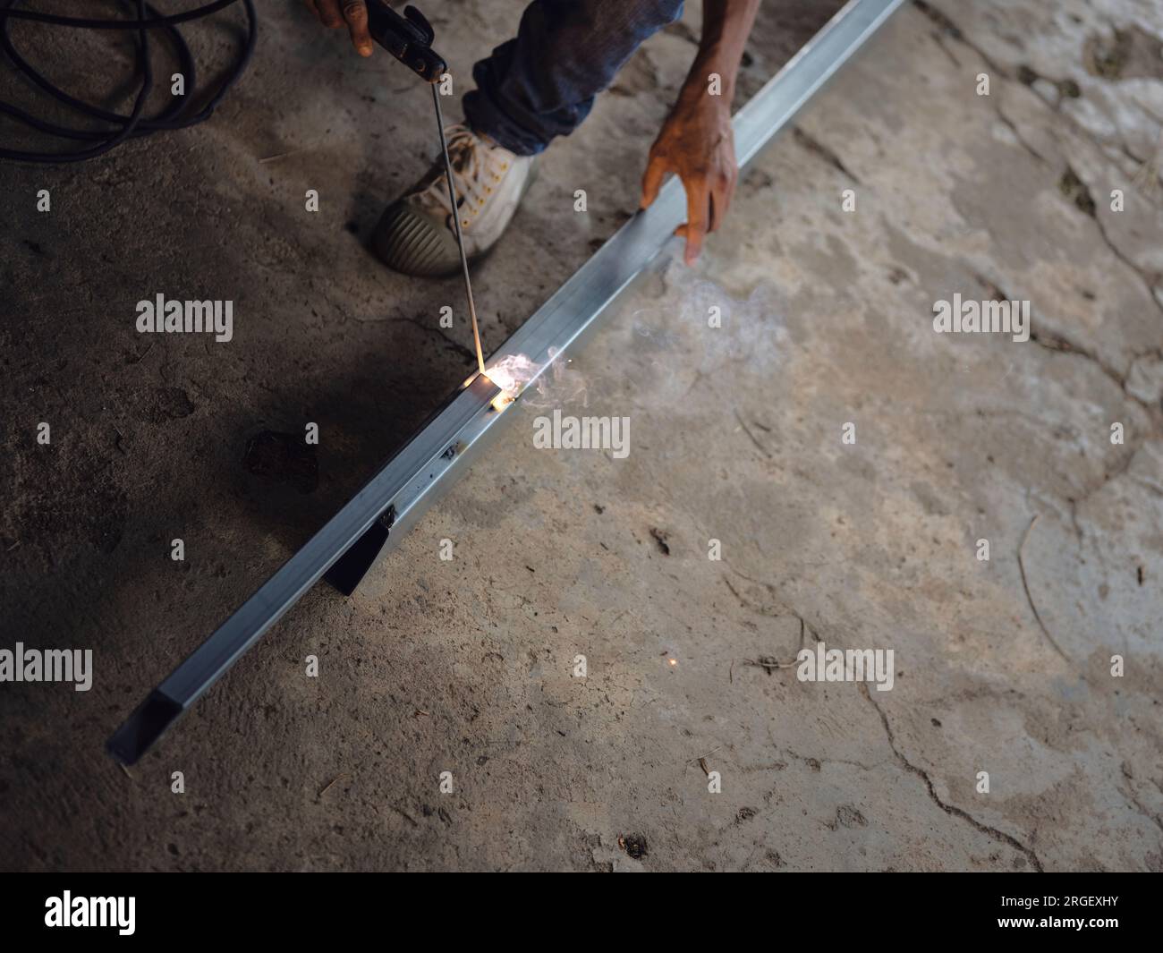 worker man welding , Manual Metal Arc Welding rack Stock Photo - Alamy
