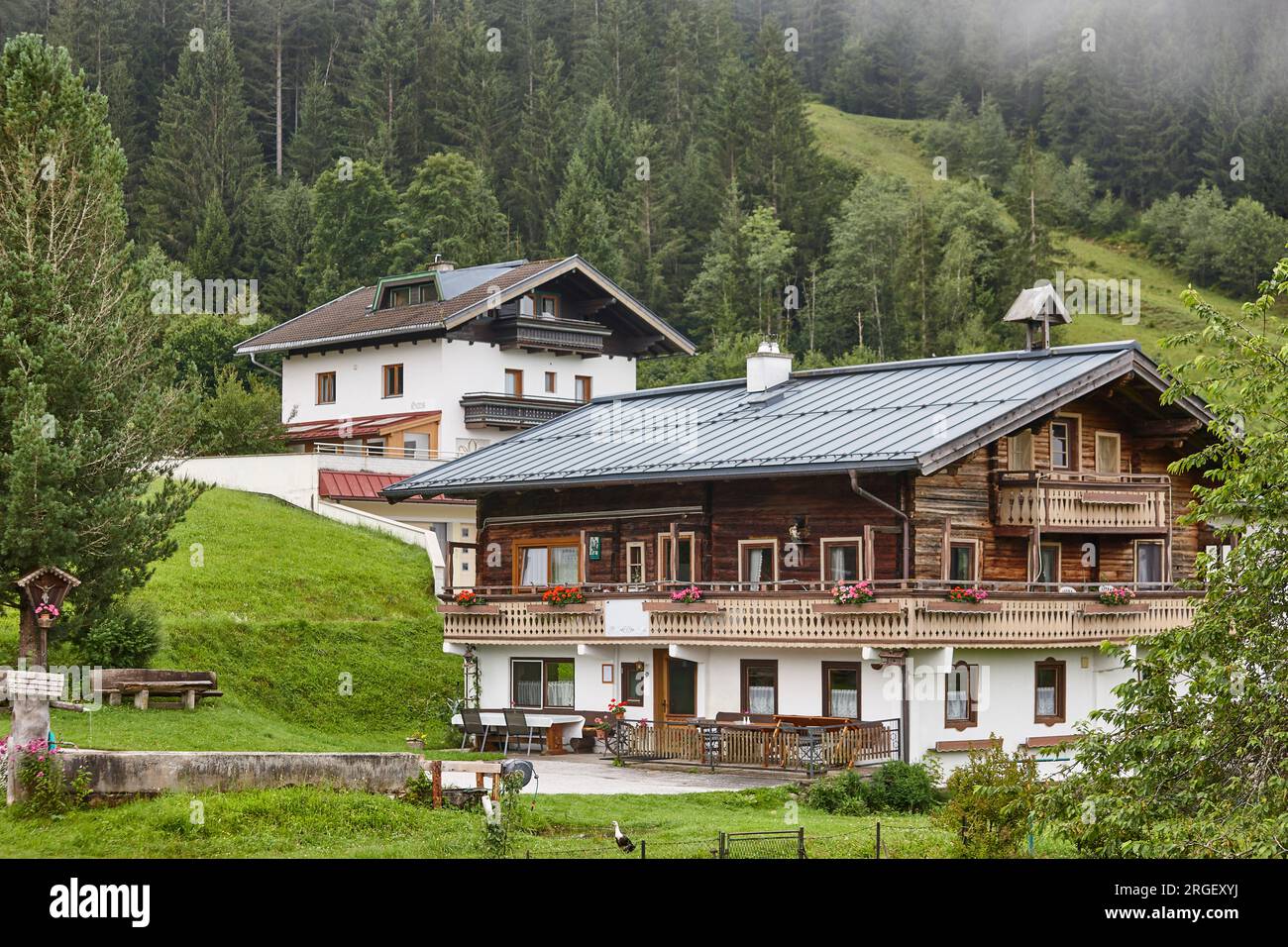 Traditional countryside cottages in the forest. Tirol region. Austria ...