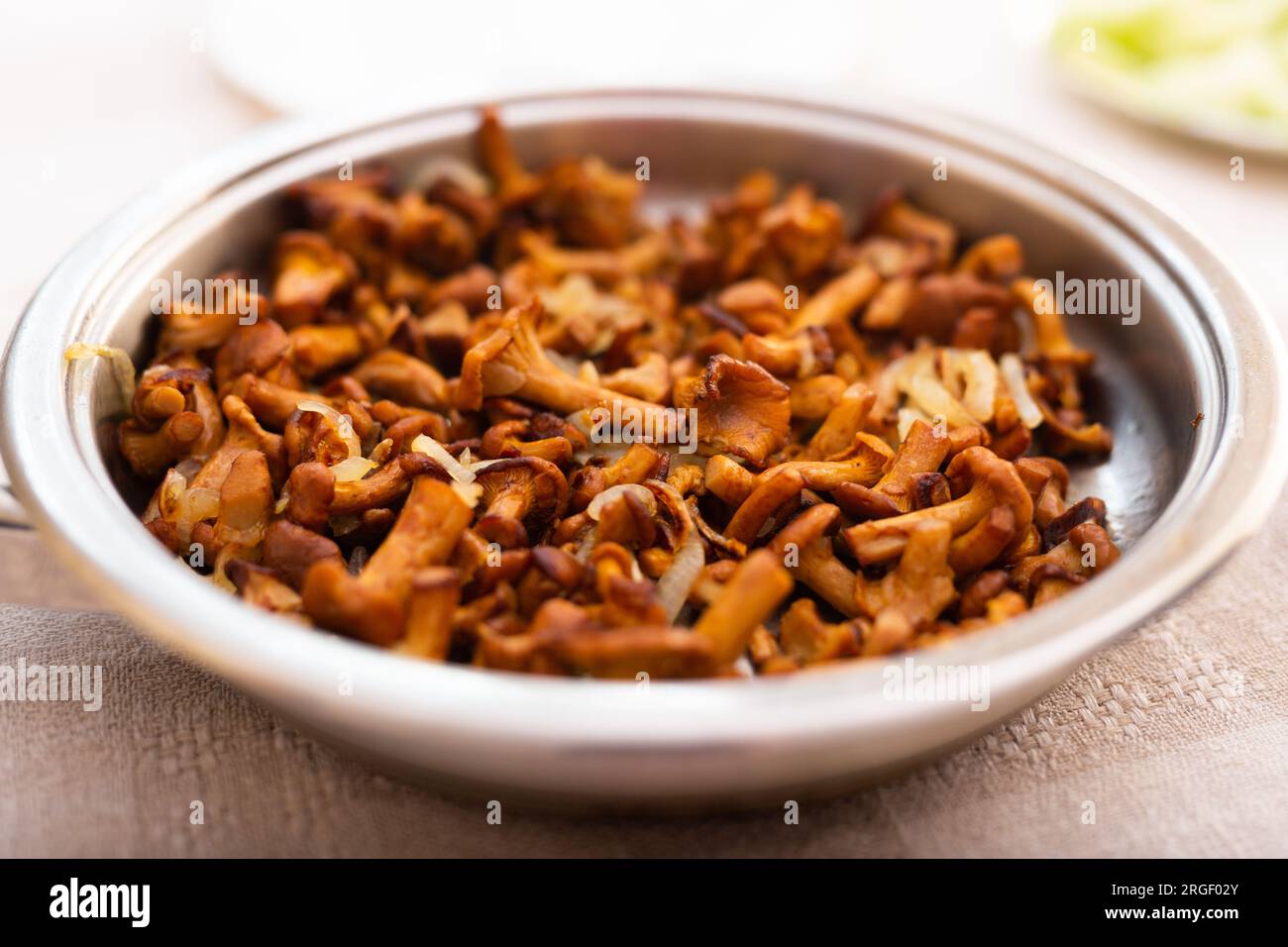 Delicious forest mushrooms chanterelles fried in frying pan Stock Photo ...