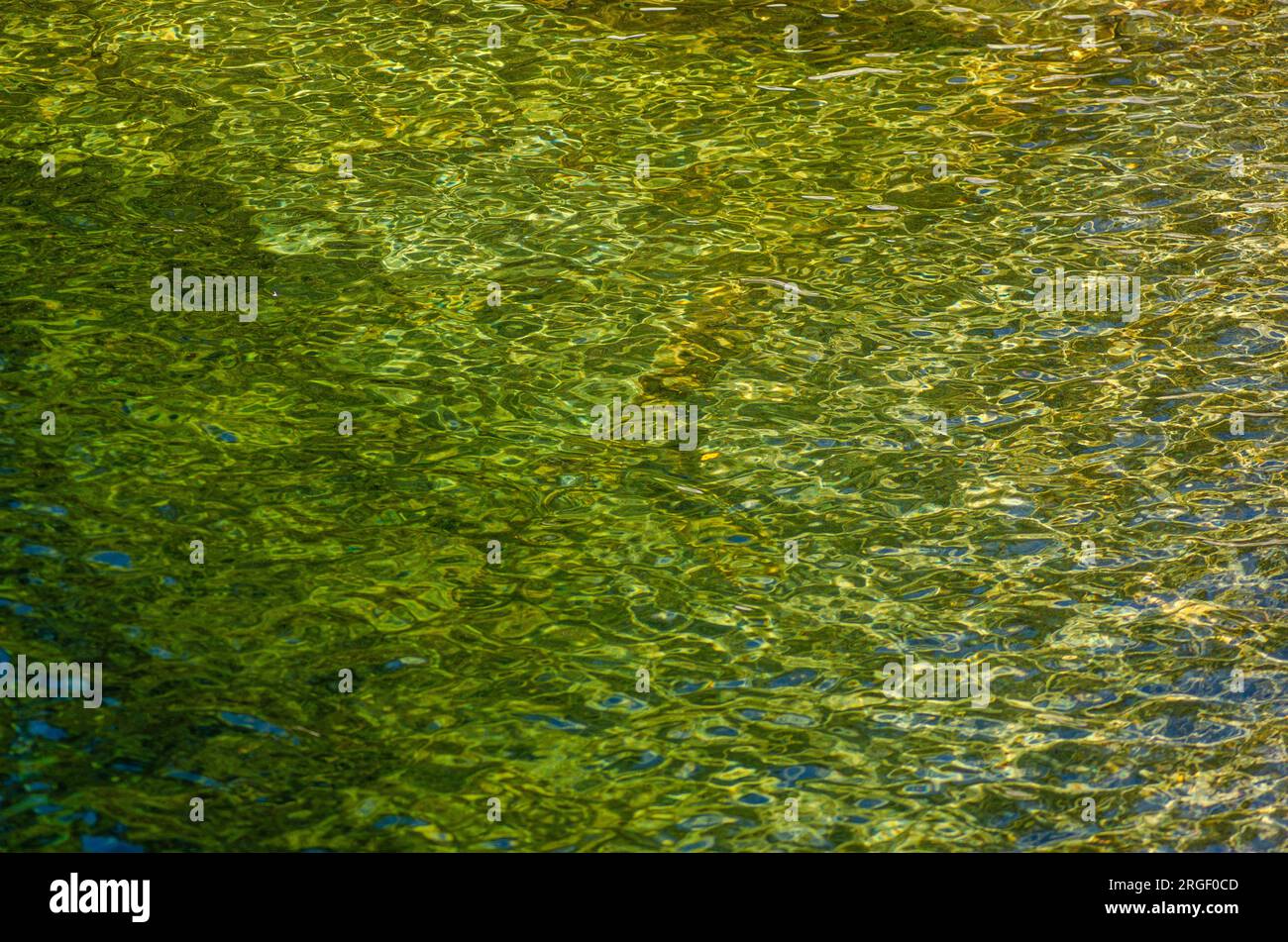 selective focus, detail of a stream of water on a granite soil Stock ...