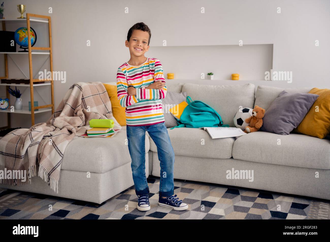 Full body photo of cheerful confident schoolboy folded arms posing ...