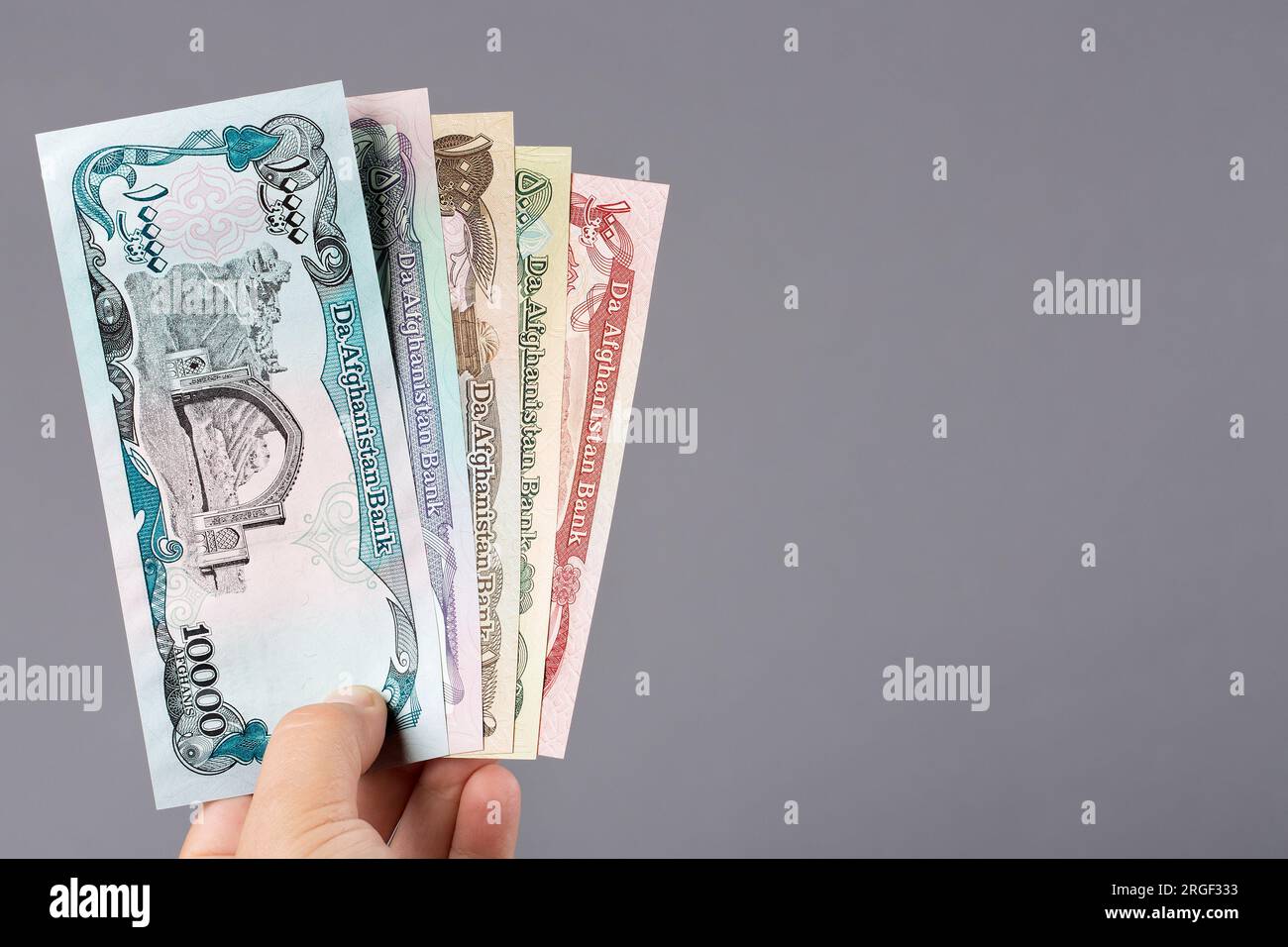 Hand to hand afghanistan hi-res stock photography and images - Alamy