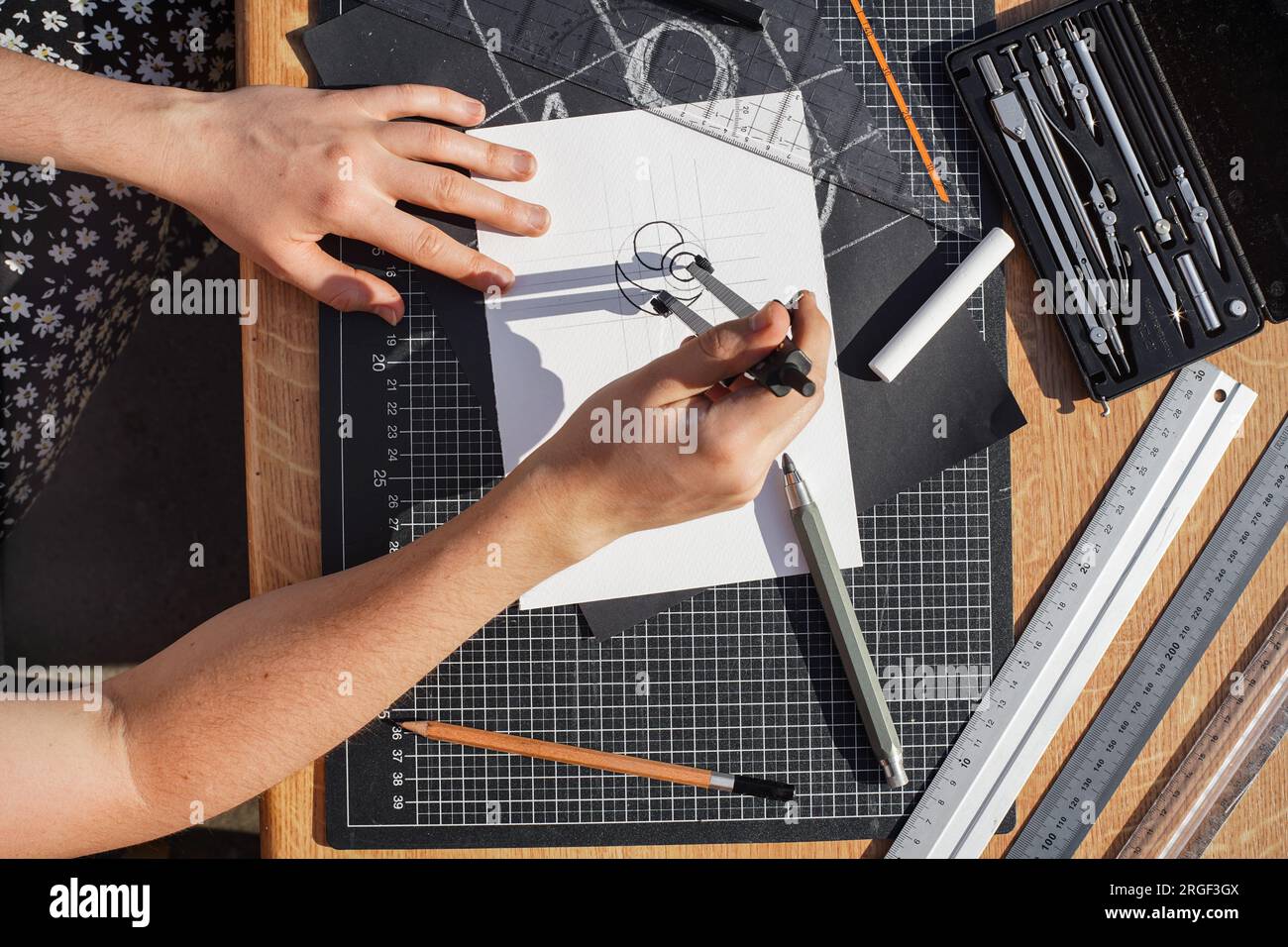 Drawing geometry hands ruler compass hi-res stock photography and images - Alamy