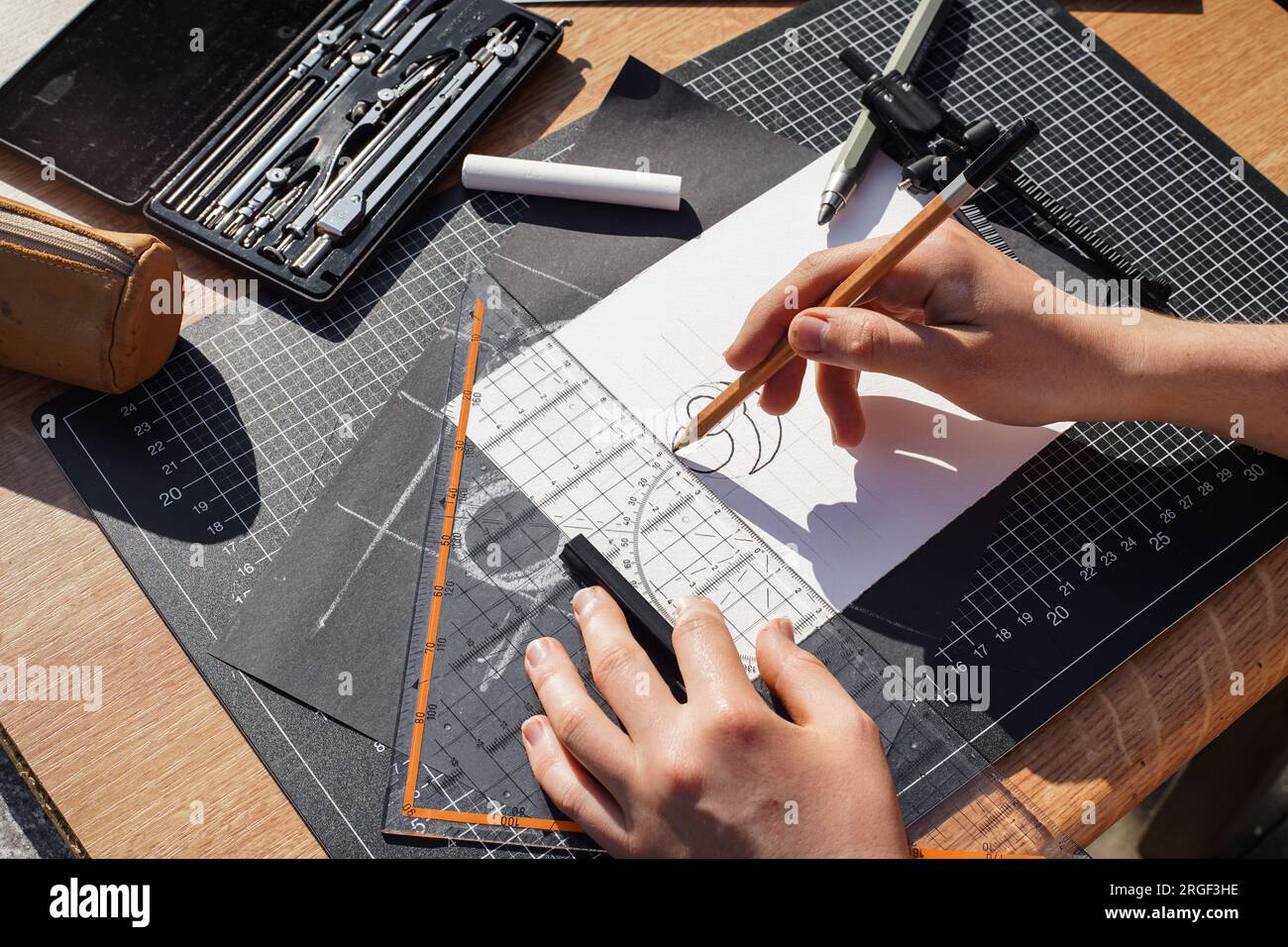 Architect and designer working accurately on a project drawing sketches ...