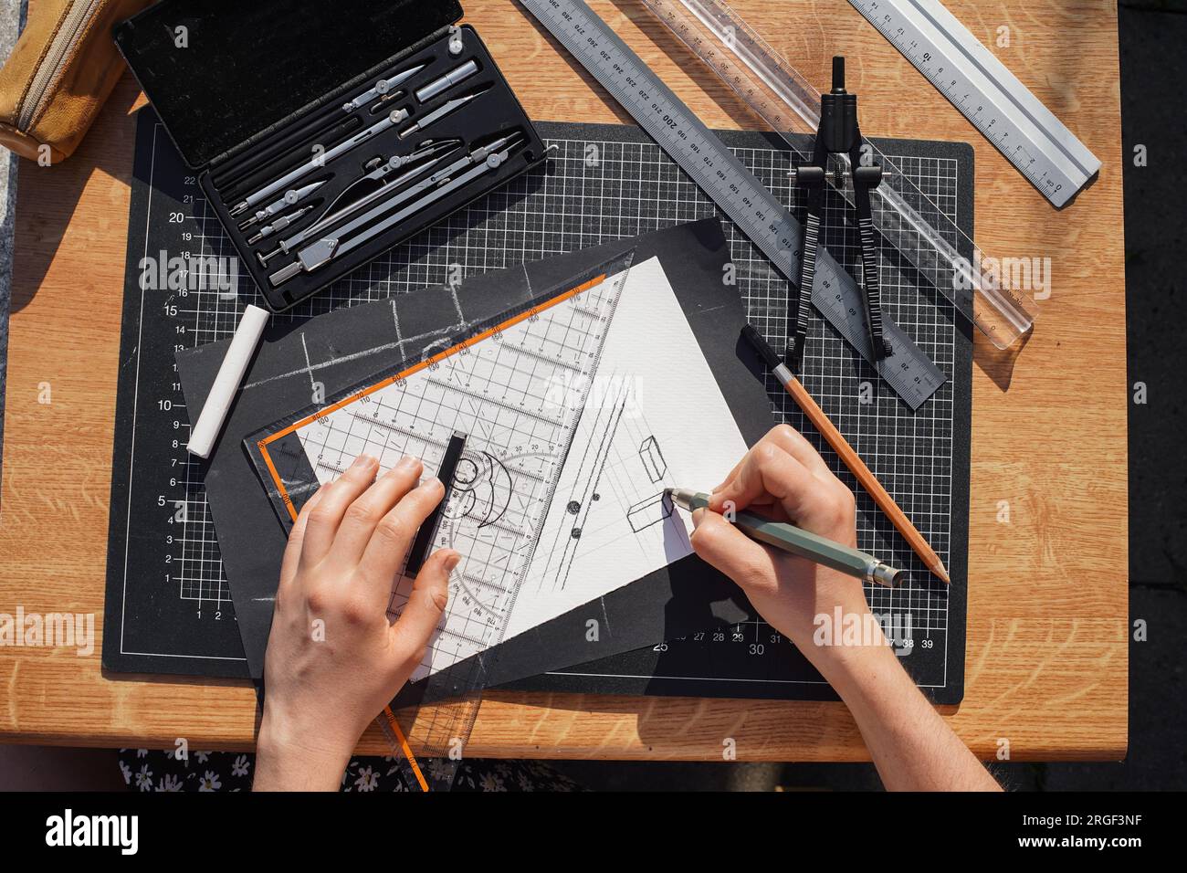Architect and designer working accurately on a project drawing sketches ...