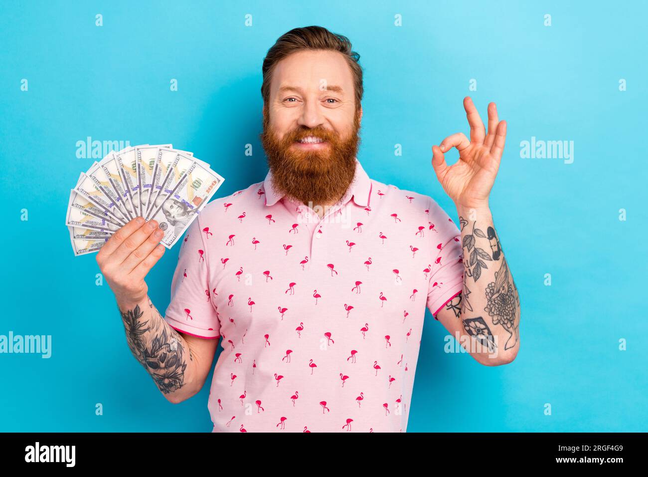 Portrait of cool cheerful man with cool tattoo wear flamingo t-shirt ...