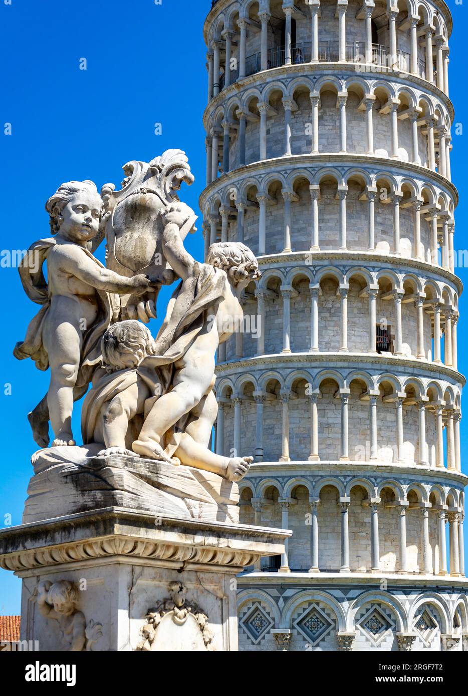 statue with leaning tower in pisa Stock Photo - Alamy