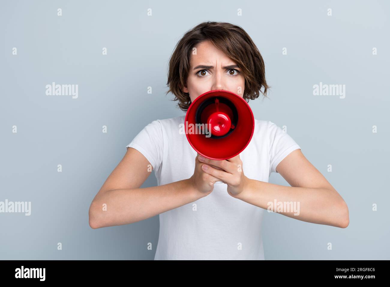 Photo of aggressive mad serious woman with short hairdo dressed white t ...