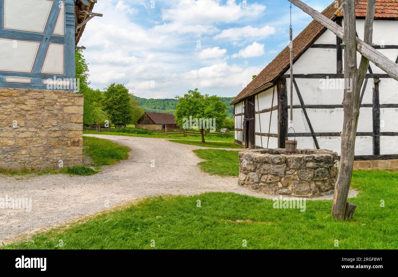 Idyllic scenery around a draw well in a rural village in Hohenlohe, an ...