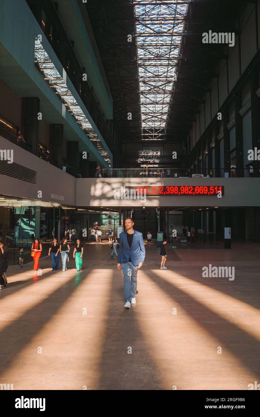 Visitors walking in Turbine Hall of Tate Modern Museum Stock Photo - Alamy