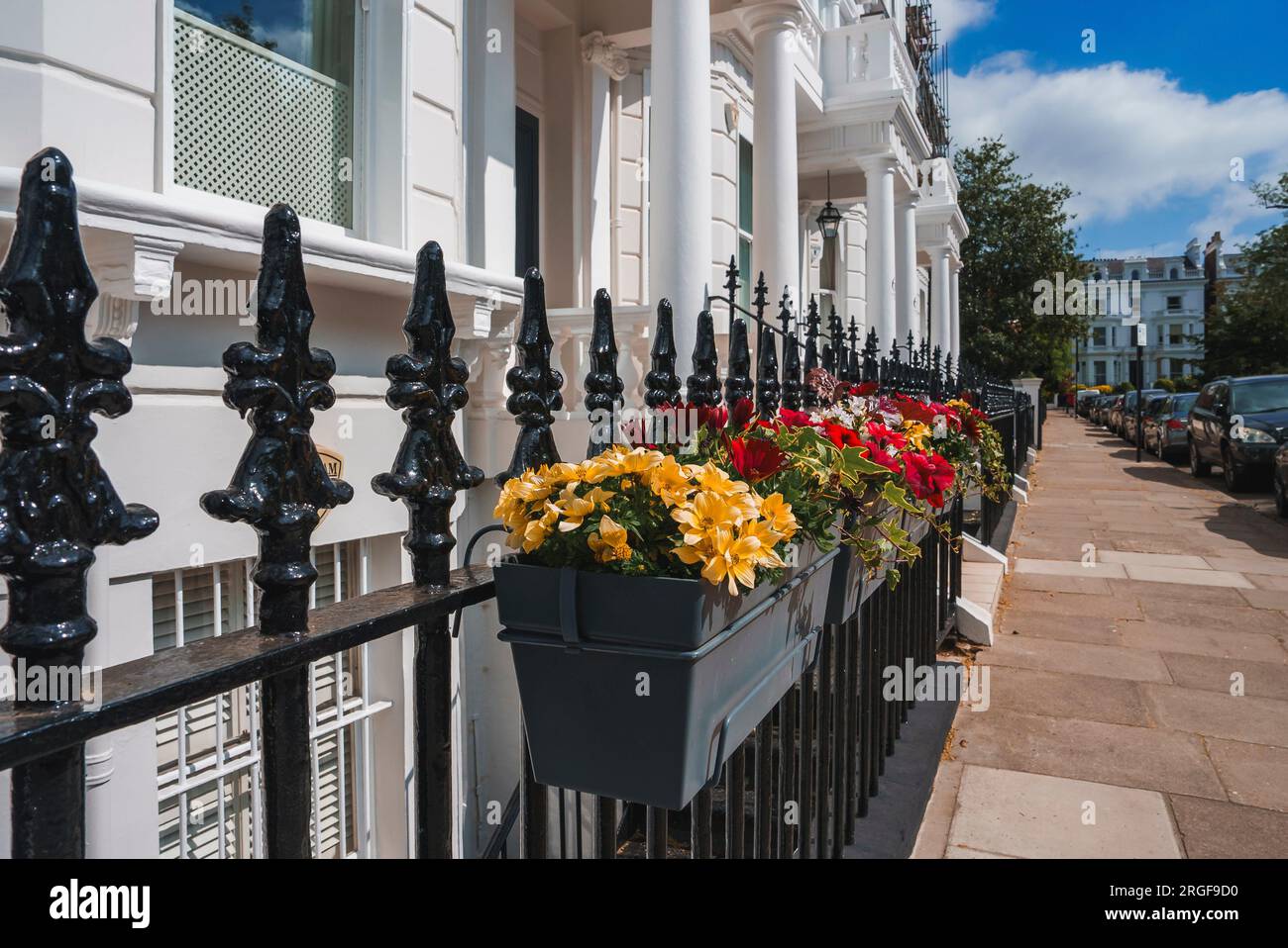 Flower pots hanging on railing of luxurious property in London Stock ...