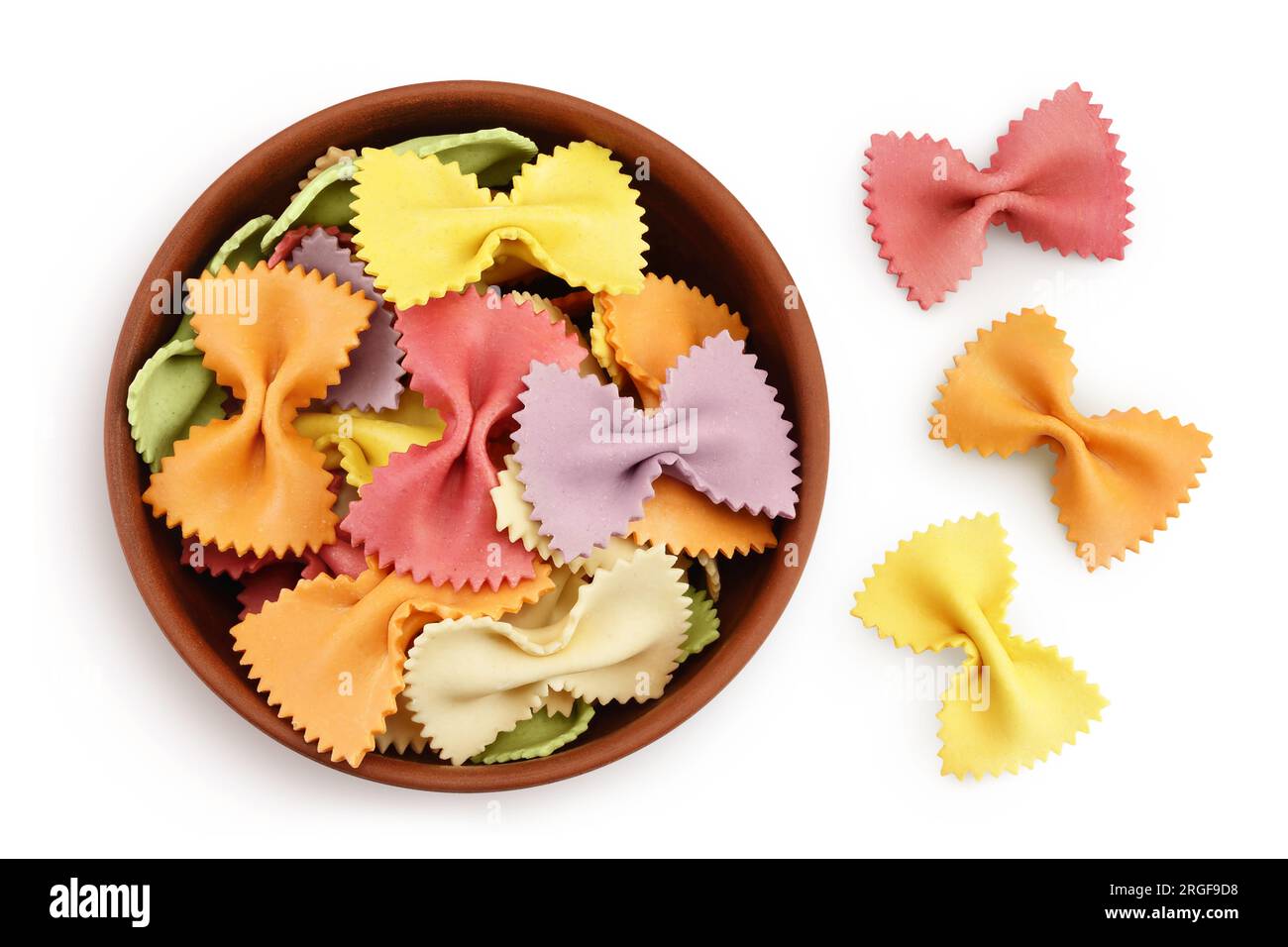 colorful farfalle pasta in ceramic bowl isolated on white background ...