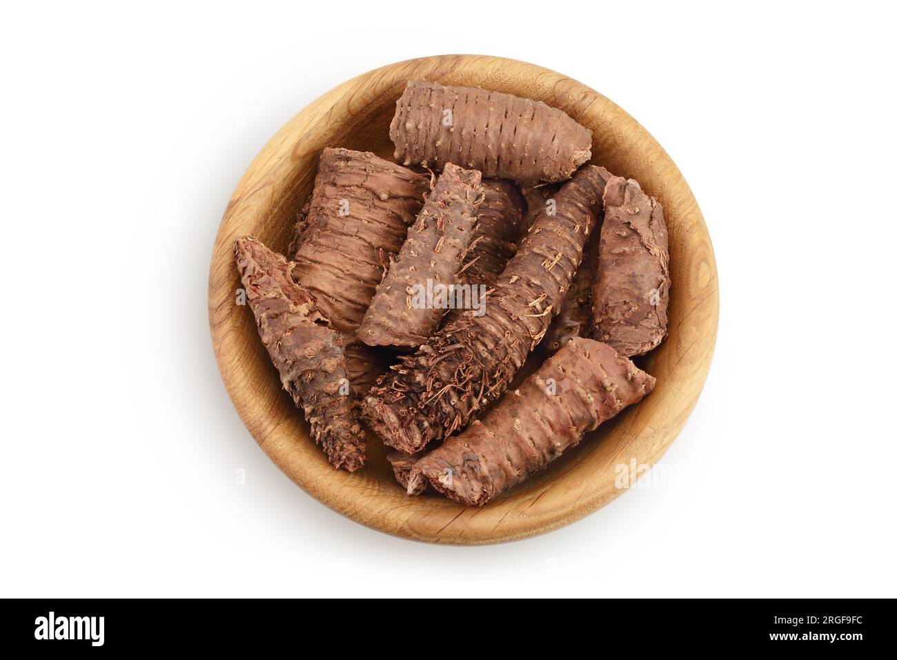 Rhodiola rosea root in wooden bowl isolated on white background. Top ...