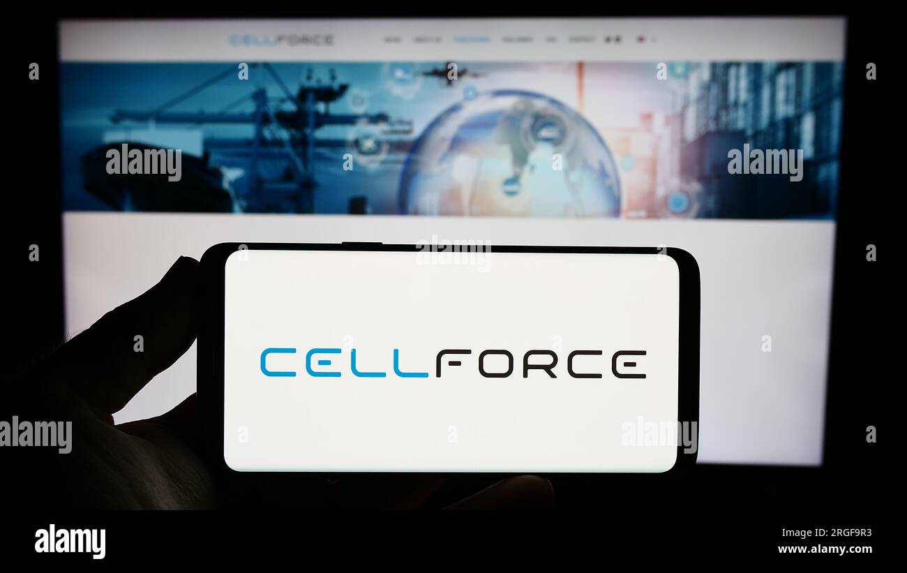Person holding smartphone with logo of German battery company Cellforce ...