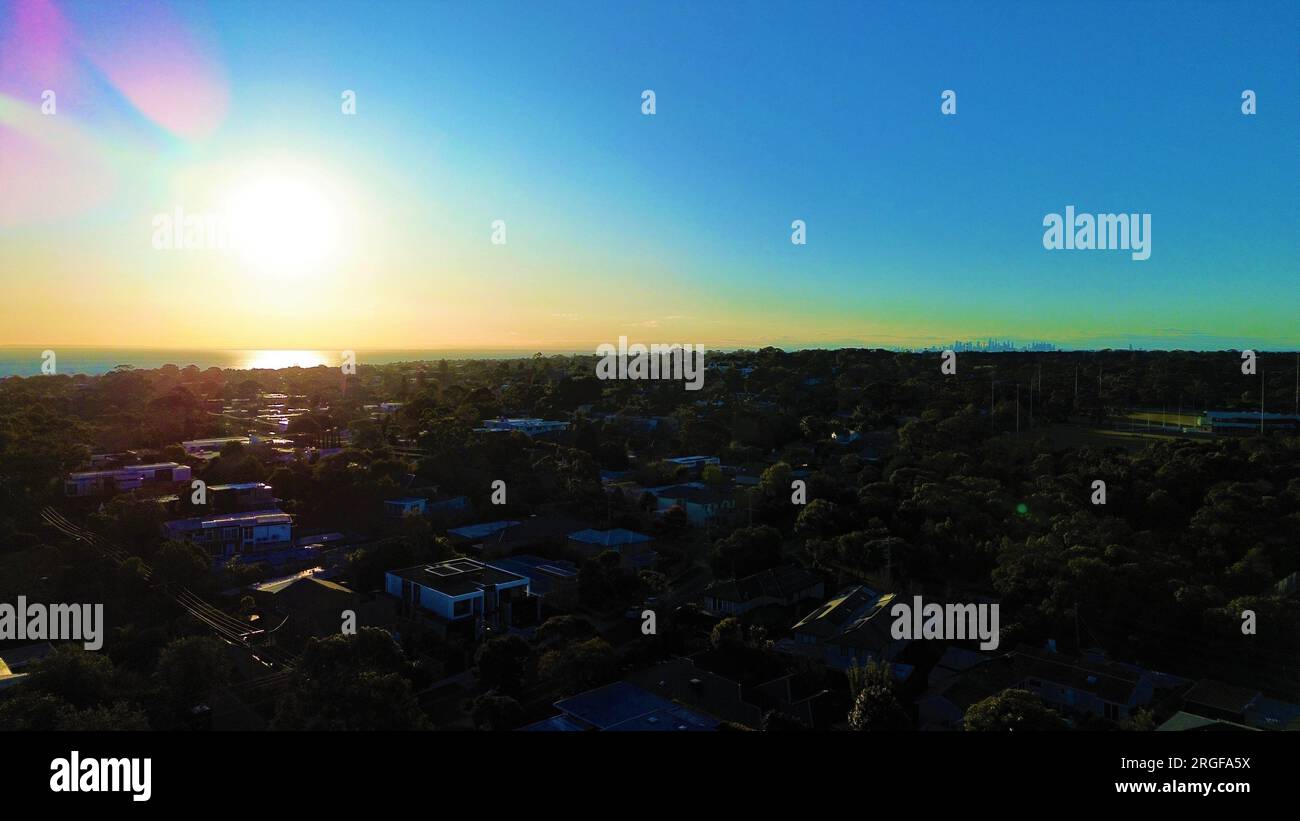 Beautiful day at the beach during a bright day next to suburbs Stock ...