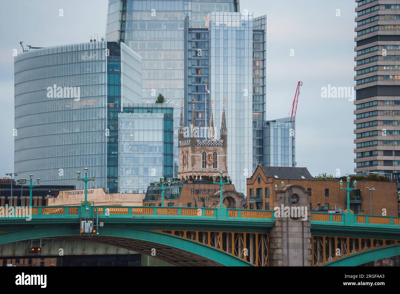 Southwark bridge and church with apartments and modern buildings in ...