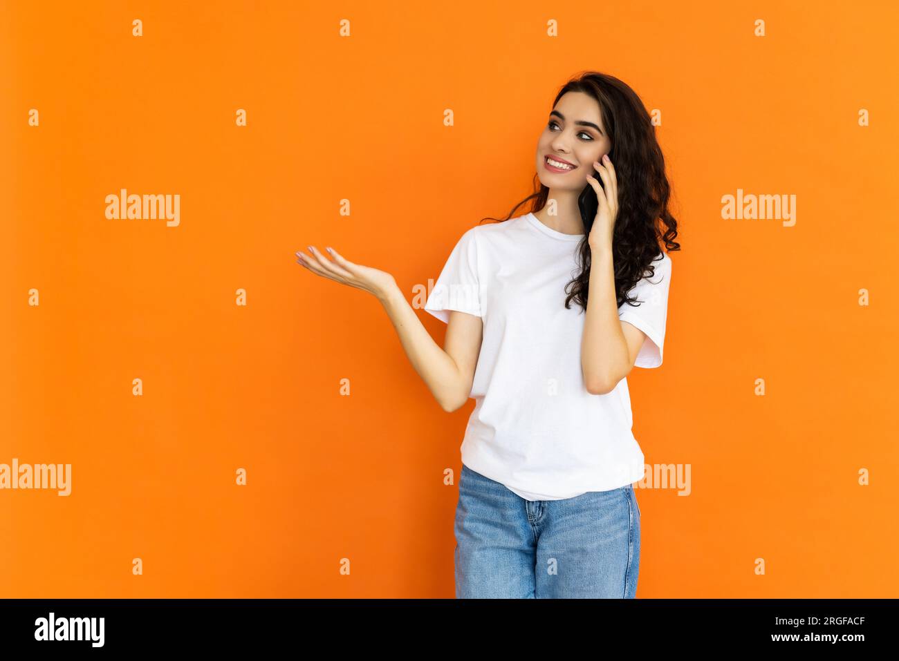 Modern communication. Coquette girl having pleasant phone conversation ...