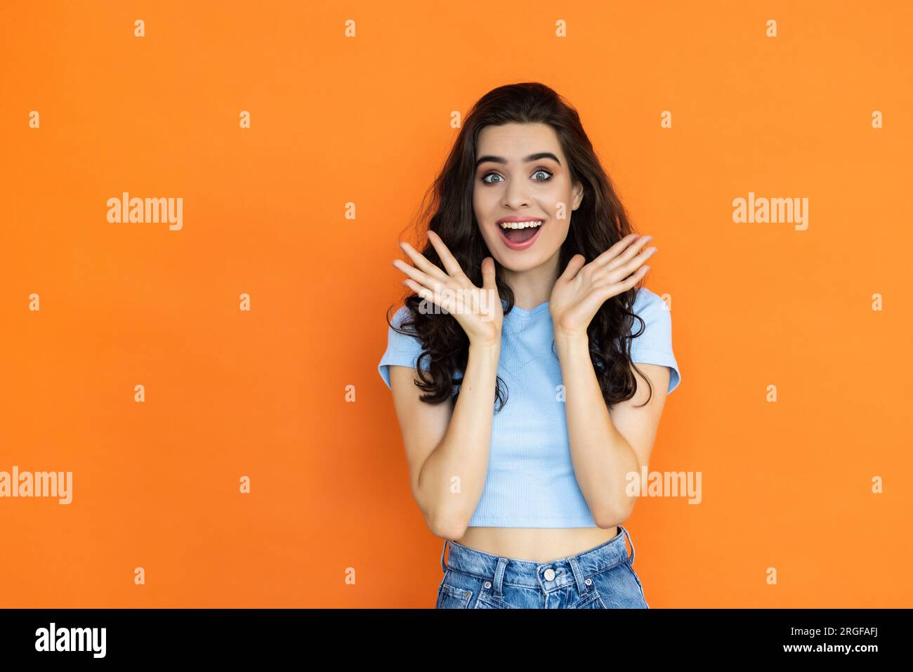 Frightened person showing shocked facial expression, standing over ...