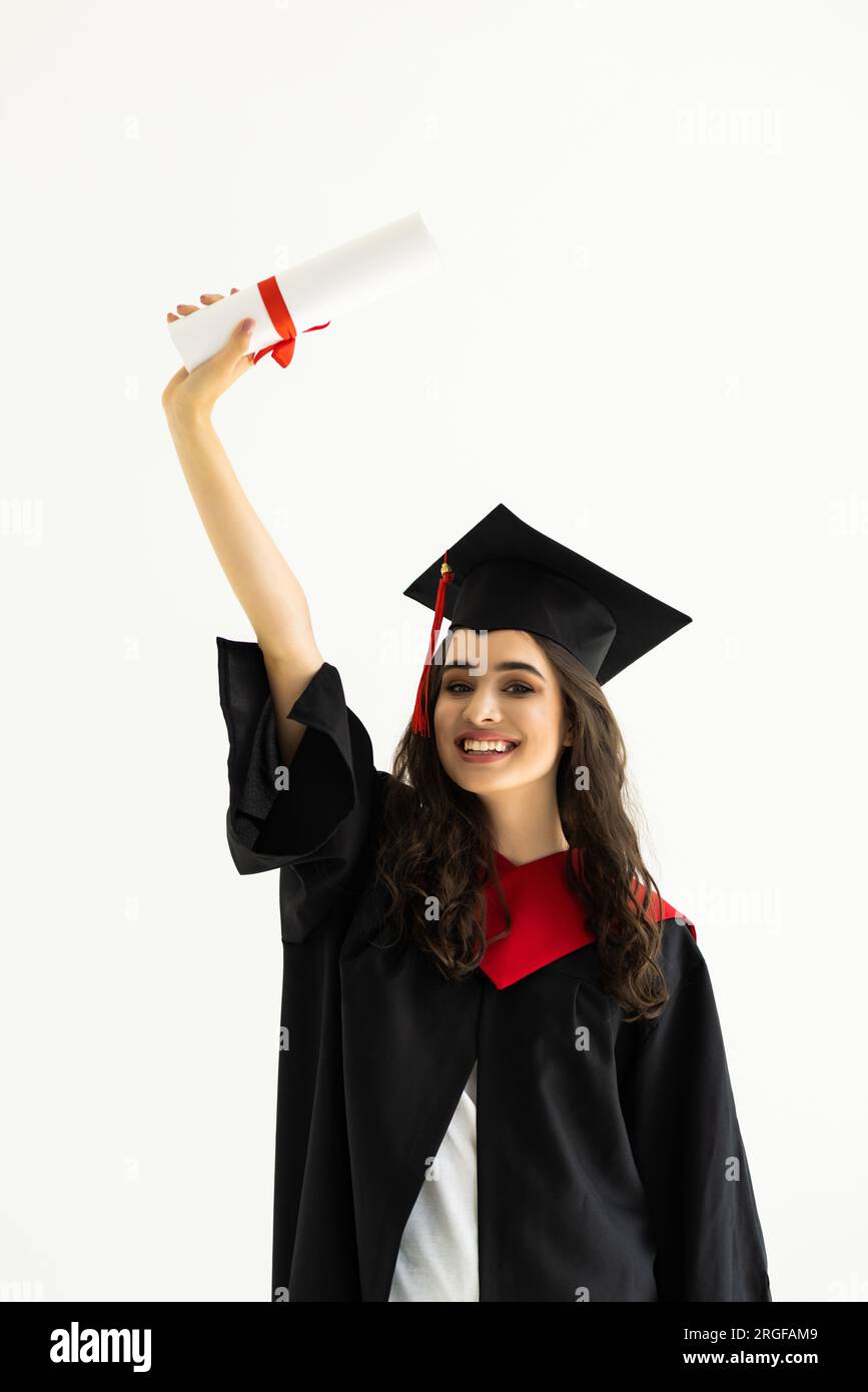 Female graduating student with diploma on light background Stock Photo ...