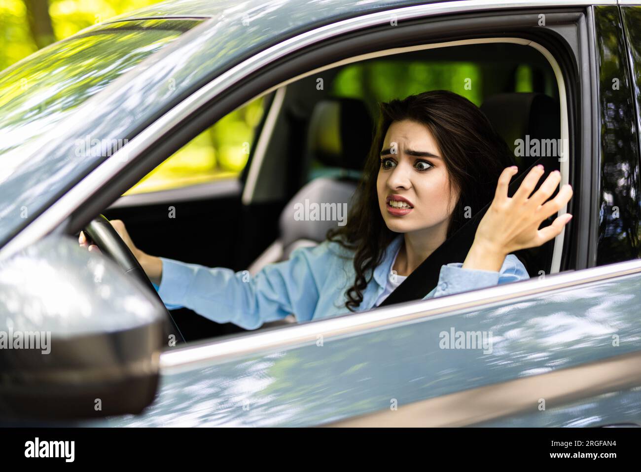 Stressed woman driver sitting inside her car. Angry female driver ...