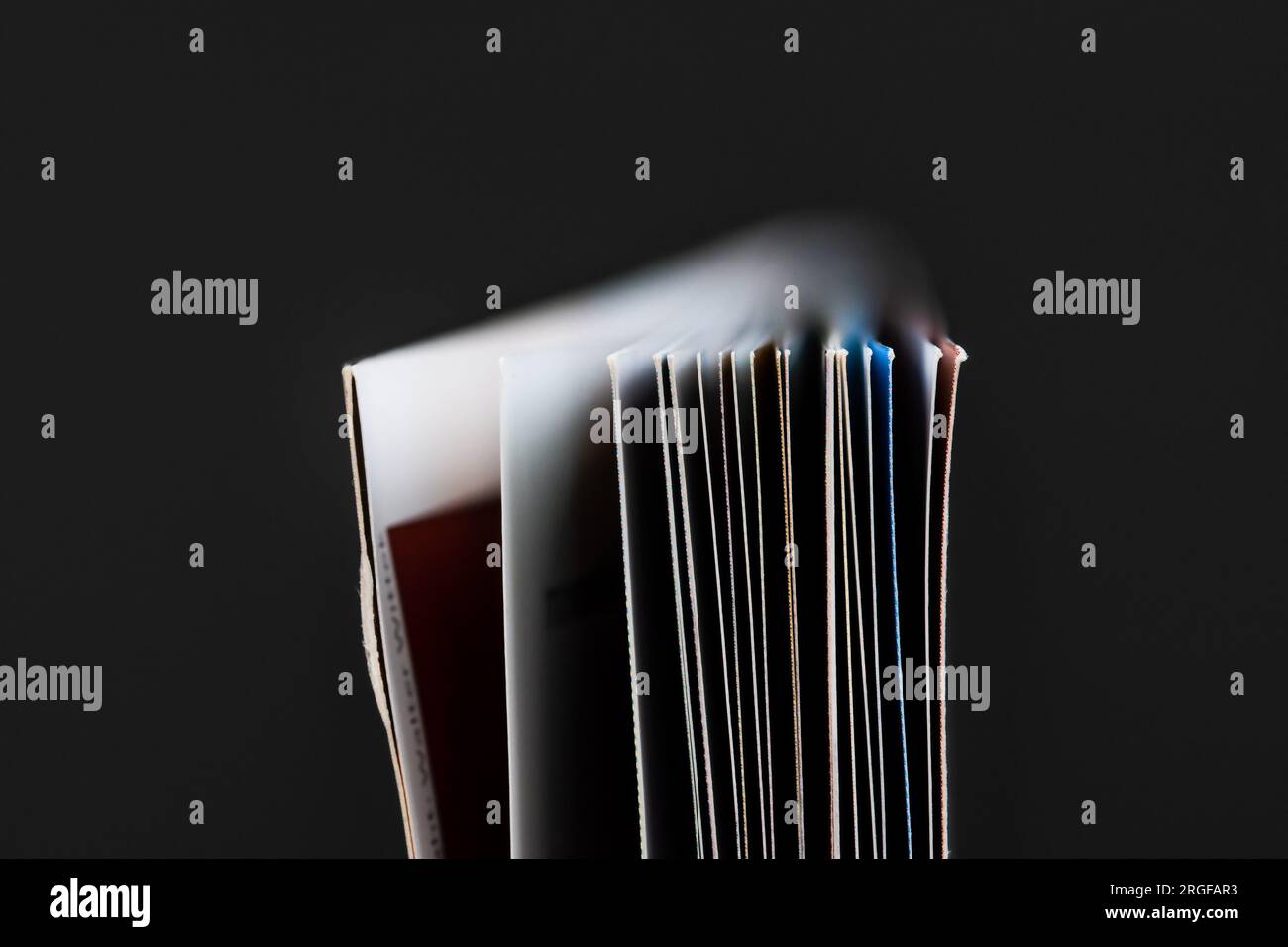 Closeup of open book pages on dark background Stock Photo - Alamy