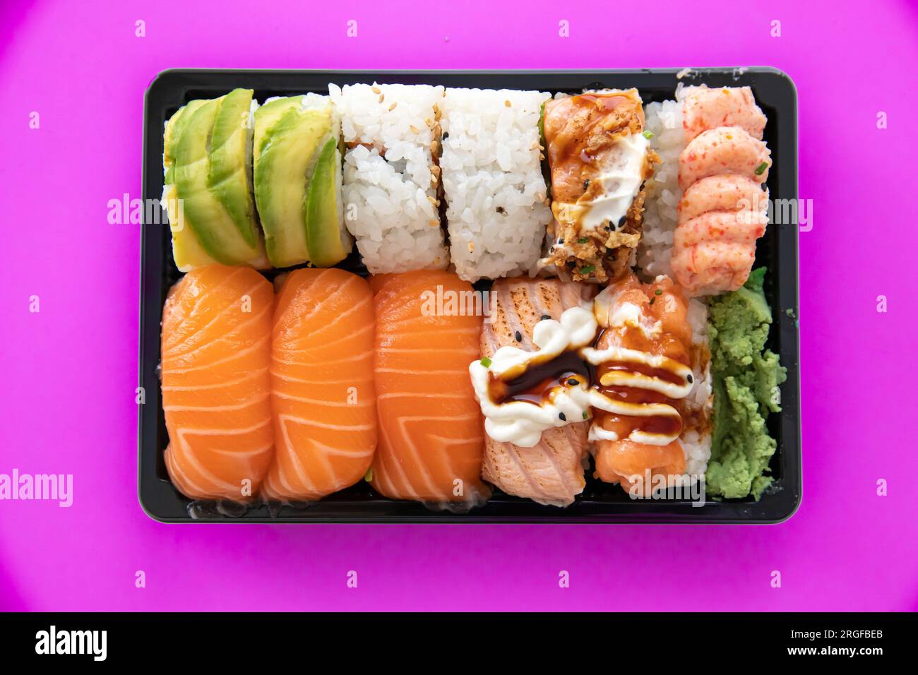 A Top view of take away sushi package isolated on coloful background ...