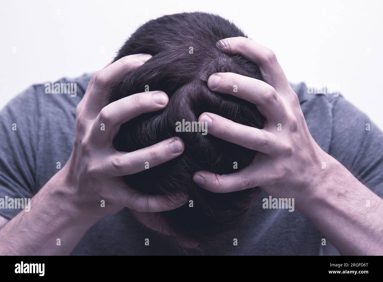 Man holding his head for having breakdown or panic attack Stock Photo ...