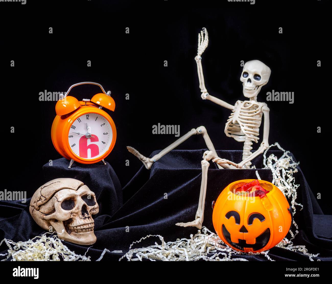 Halloween time. A toy Skeleton crawling out of the grave, and waving ...