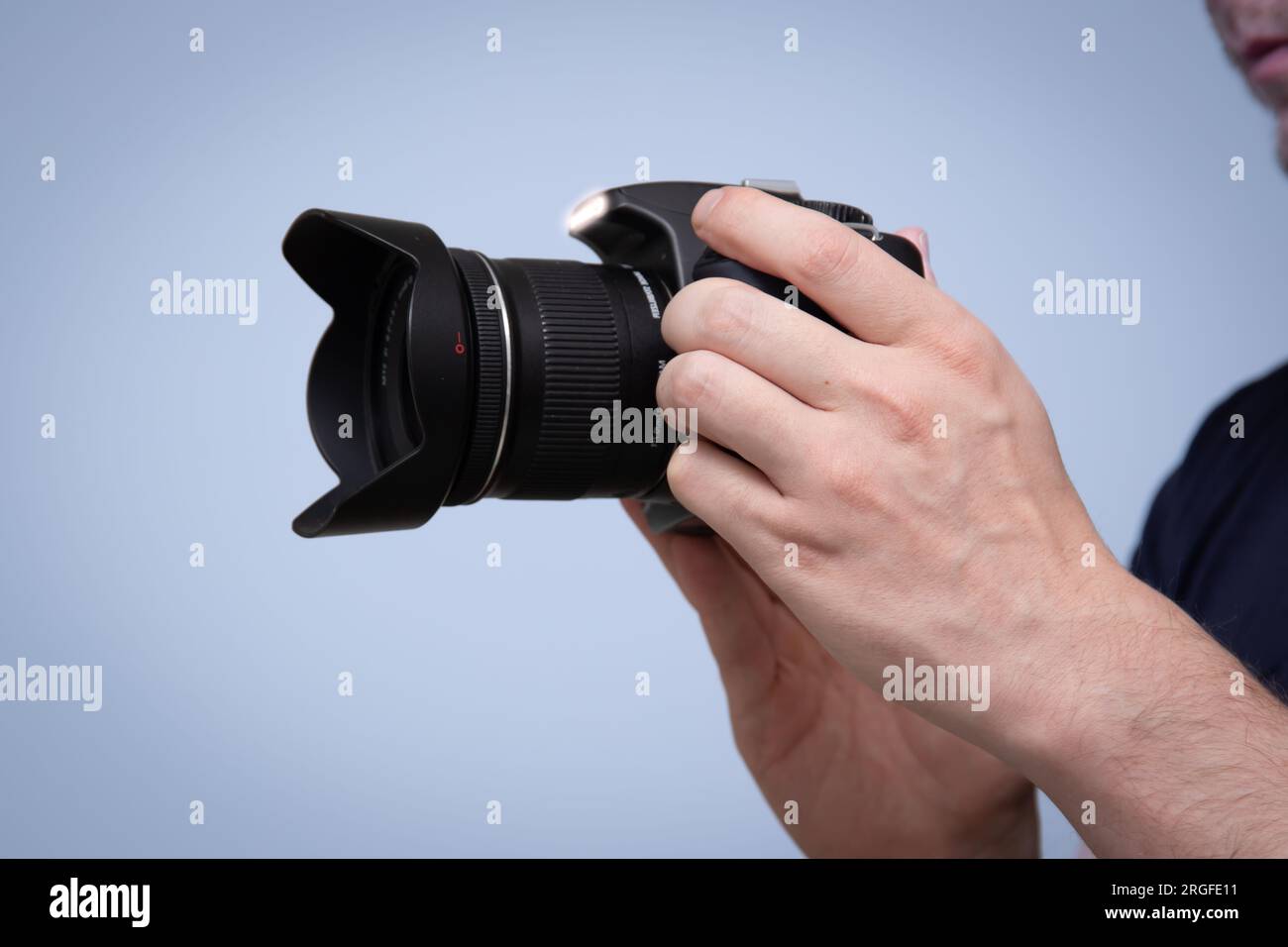 A Man using a dslr camera Stock Photo - Alamy