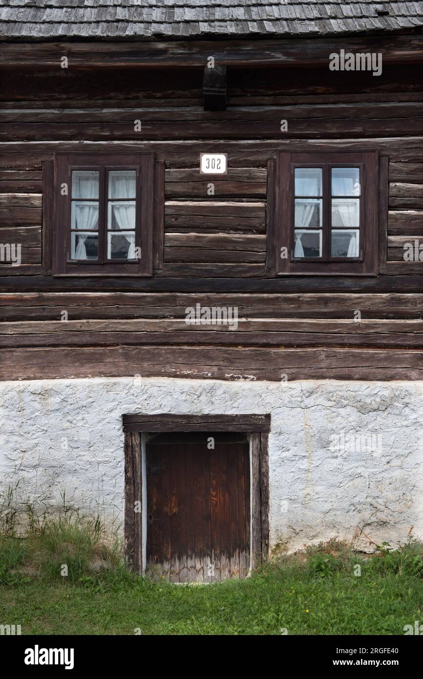 Wooden traditional home. Small door at ground level would have been ...