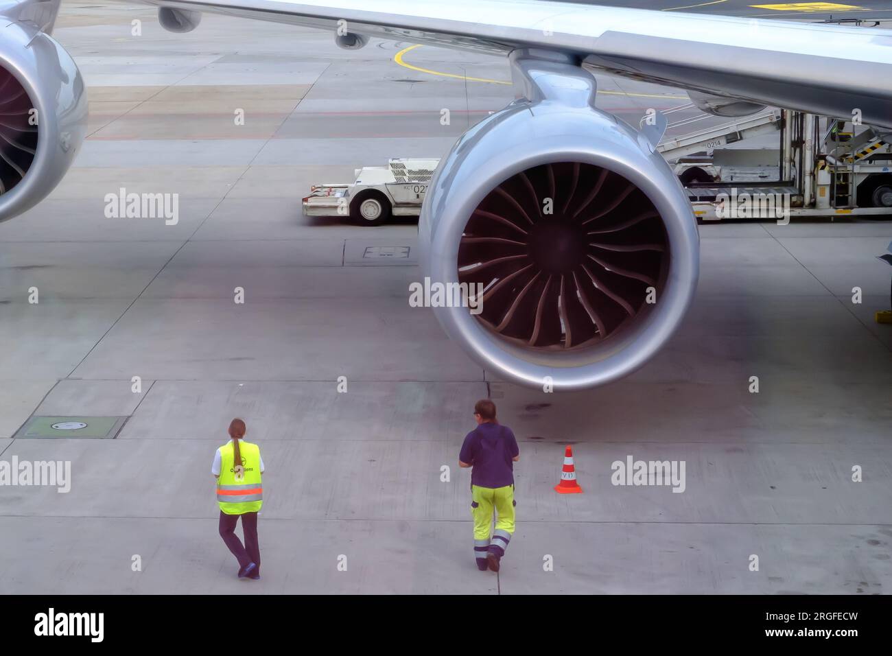 Munich, Germany - August 16, 2027 : View of airport employees next to ...