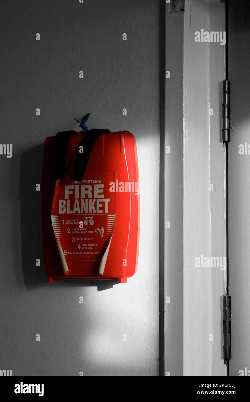 Color isolated red fire blanket on black and white surrounding Stock ...