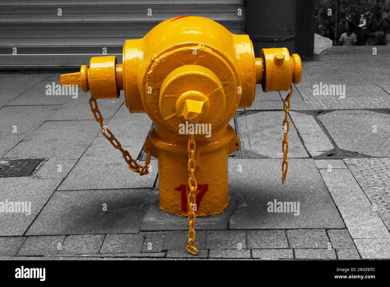 Color isolated yellow fire hydrant in Hong Kong on black and white ...