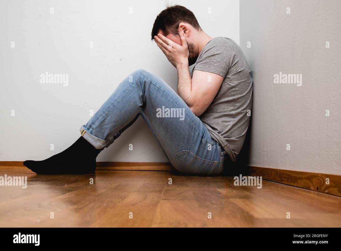 Man in corner of room hi-res stock photography and images - Alamy
