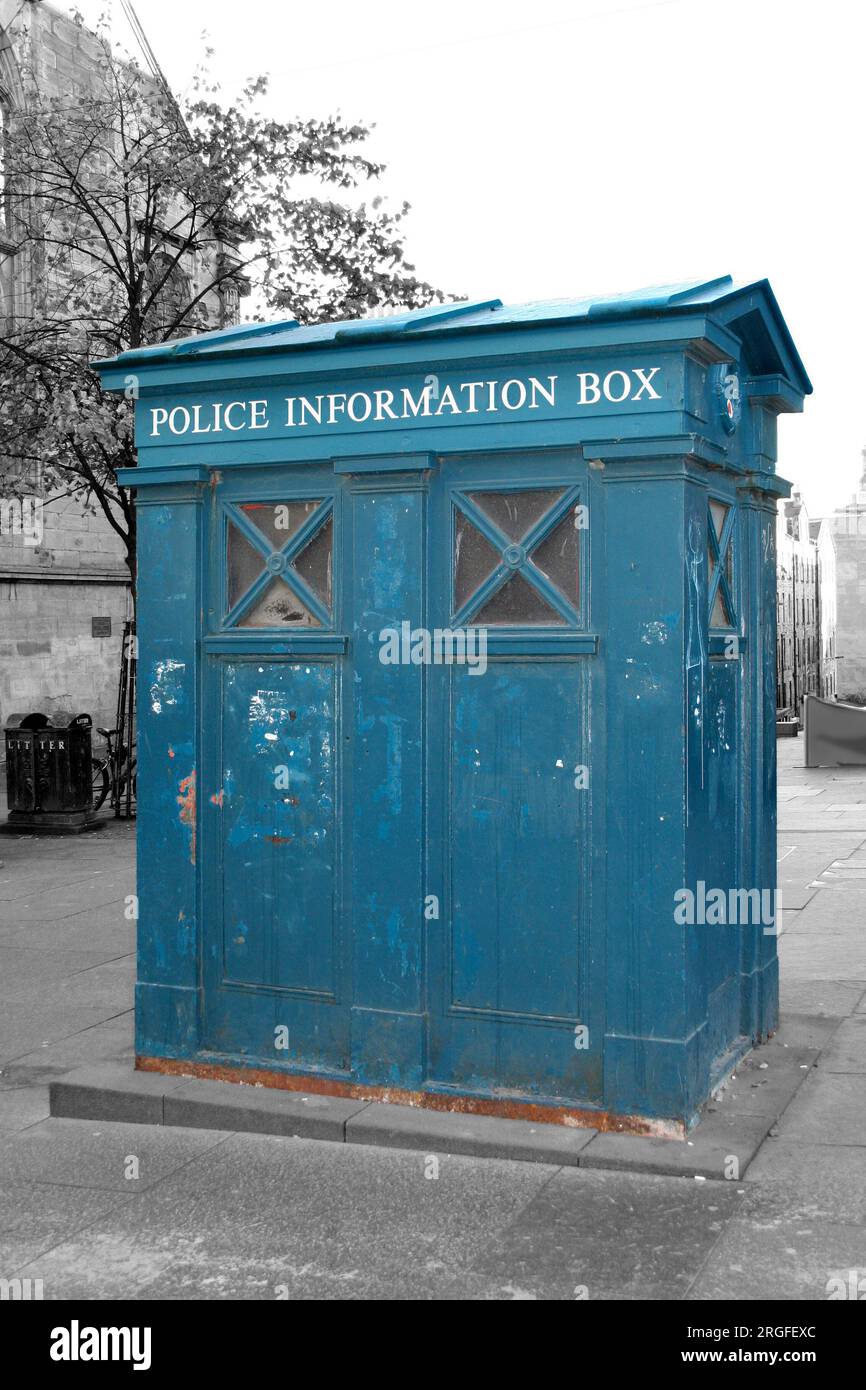 Color isolated blue police information box in Edinburgh on black and ...