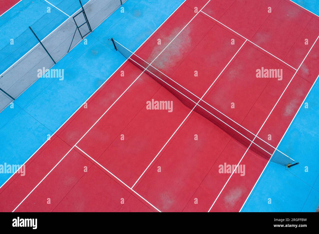 Red and blue tennis court from an aerial view Stock Photo - Alamy
