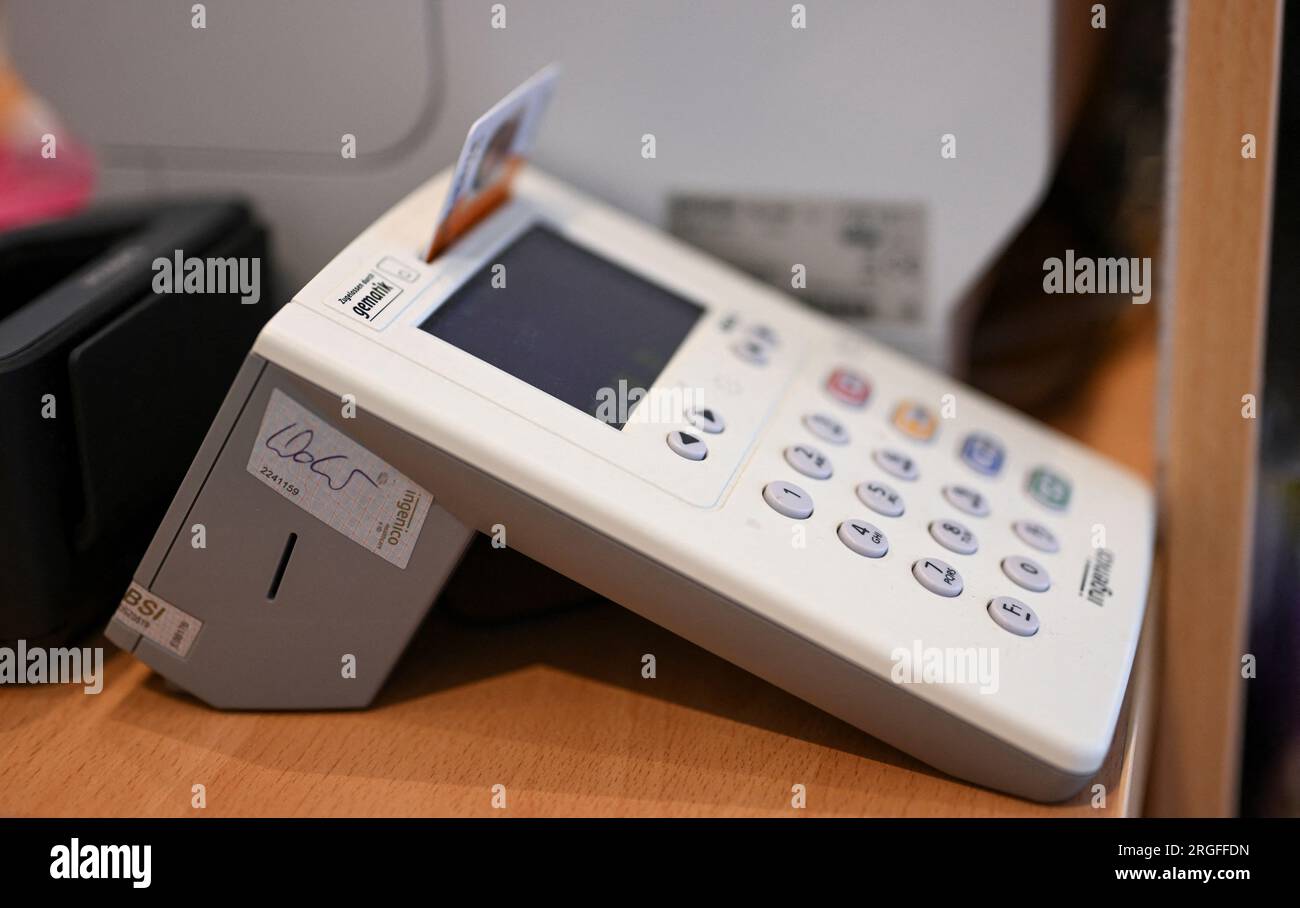 Berlin, Germany. 09th Aug, 2023. A patient's health card is inserted ...