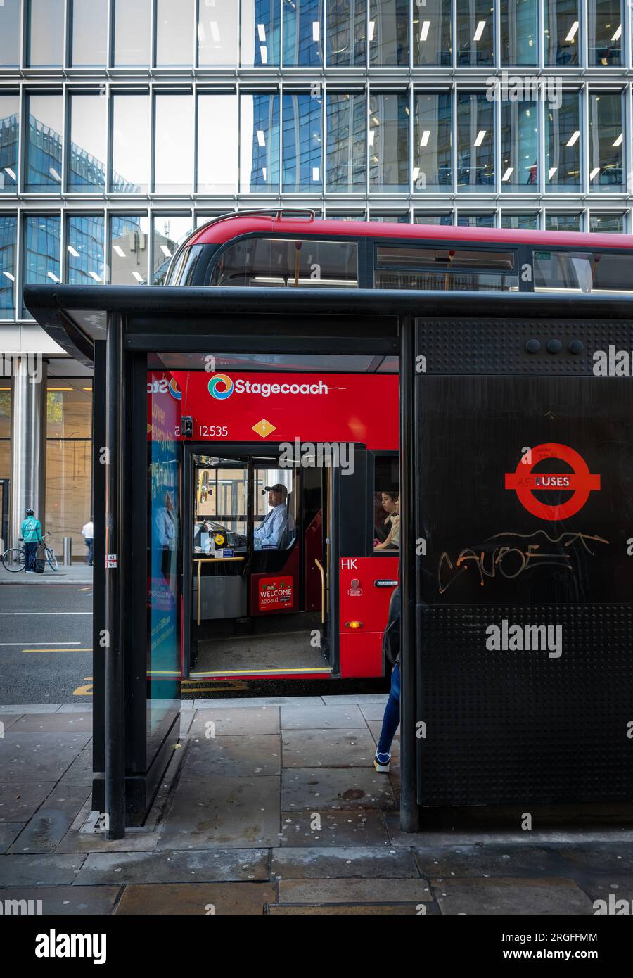 London, UK: Bus stop on Bishopsgate in the City of London. Red London ...