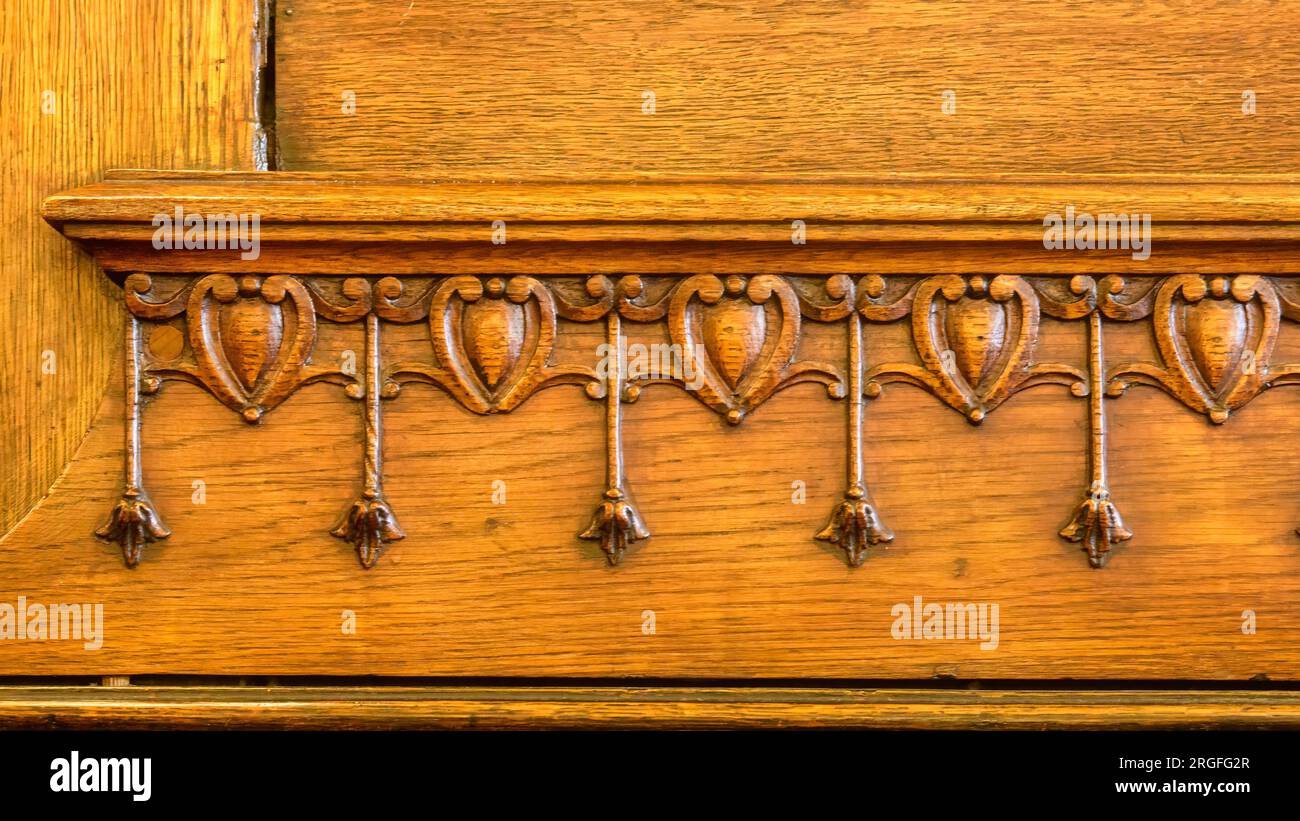Decorative wood carving in the frame of a large mirror. Architectural ...
