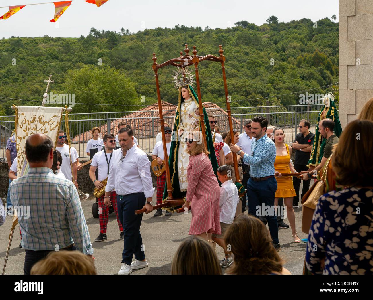 Village fiesta procession of villagers with statue of Virgin Mary ...