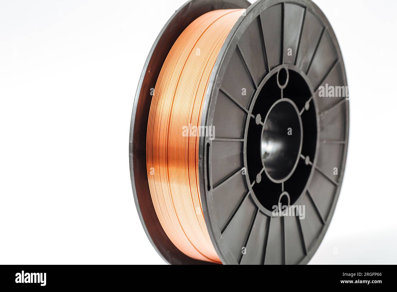 Welding wire spool on a white background Stock Photo - Alamy