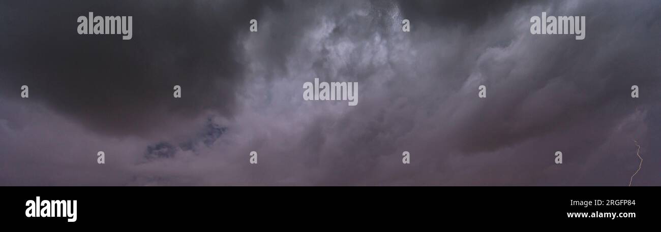 Picture of a flash in the night sky with glowing clouds in summer Stock ...