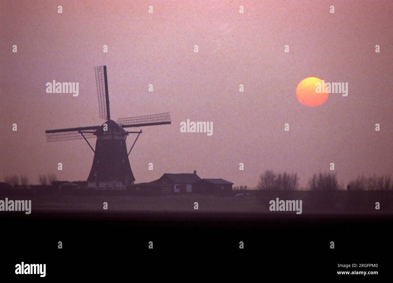 Traditional Dutch windmill at sunset, Holland, Netherlands., Europe ...