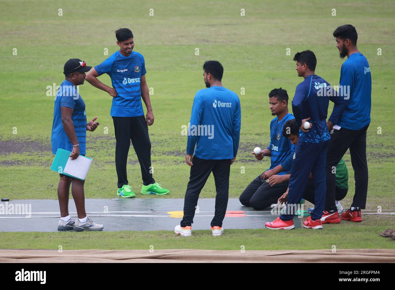 Spine bowling coach Rangana Herath along the spin bowler Mehidy Hasan ...