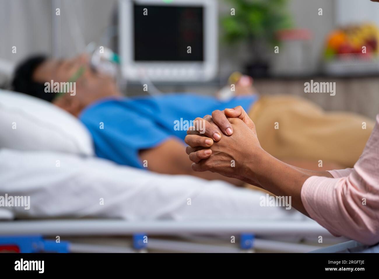 Close up shot of wife hands or family hands praying for admitted ...