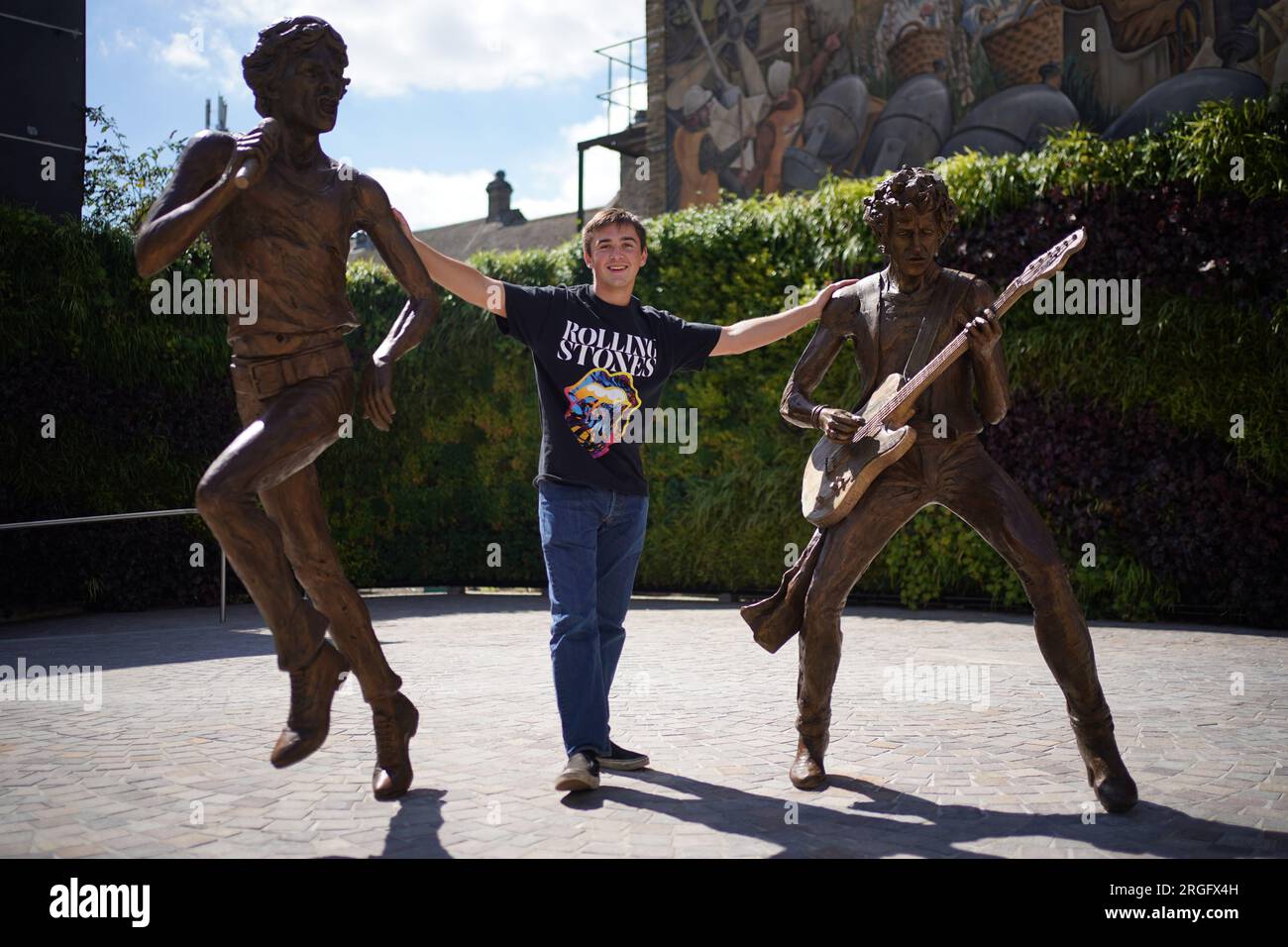 Kian Hunter aged 9 from Dartford, poses next to "The Glimmer Twins", a ...