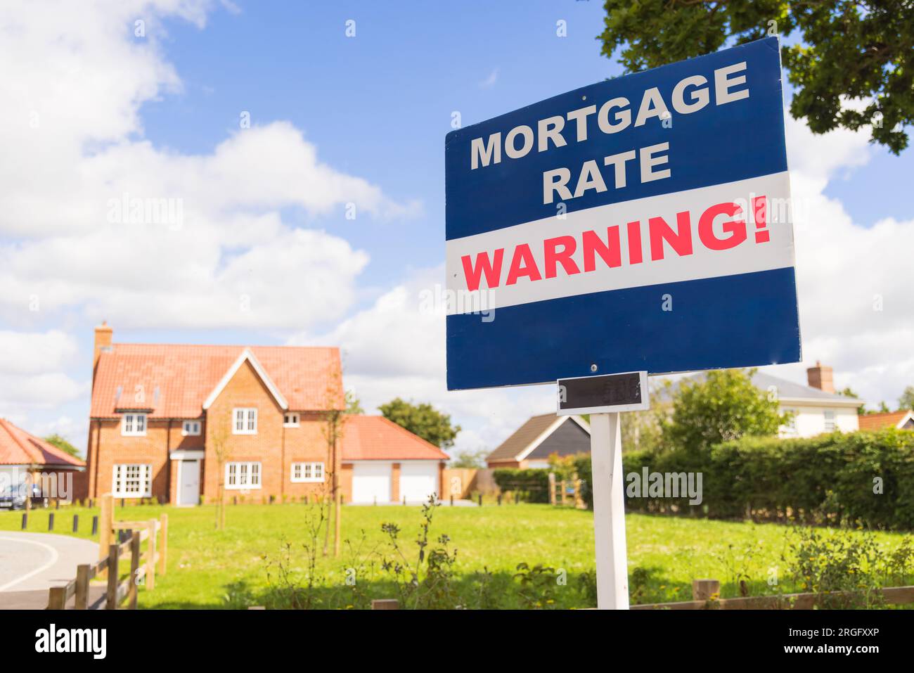 House for sale estate agent banner saying 'Mortgage Rate Warning ...